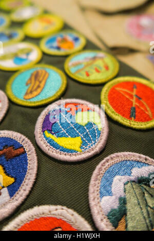 Boy scout in uniform with sash of badges Stock Photo - Alamy