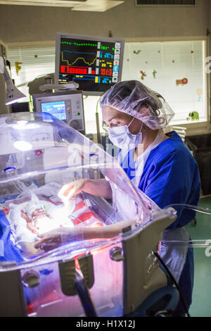 Newborn baby undergoing ultraviolet light treatment for jaundice ...