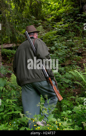 An old hunter walks in Romanian mountains Stock Photo - Alamy