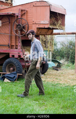 A William Foster & Co Ltd threshing machine powered by a steam traction ...