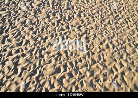 Complex beach sand ripple pattern close up at sunset Stock Photo - Alamy
