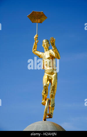 Golden Acrobat statue (clown) riding a bike at Moscow Fountain Circus ...