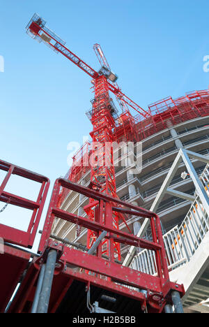 Tower cranes and construction equipment working on a new development on ...