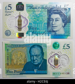 The front and back of a modern English five pound note featuring Stock ...