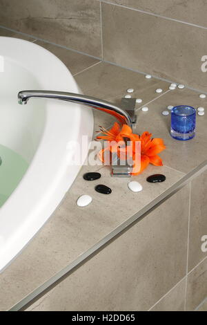 water tap with flowers in spa salon.shallow DOF Stock Photo - Alamy