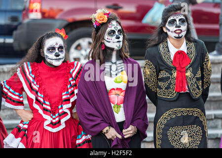 Young women, dressed as La Catrina, take part in the Day of the Dead ...