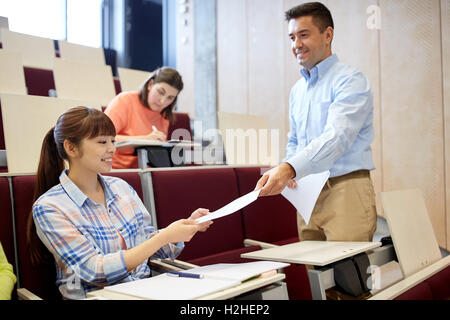 teacher giving tests to students at lecture Stock Photo - Alamy
