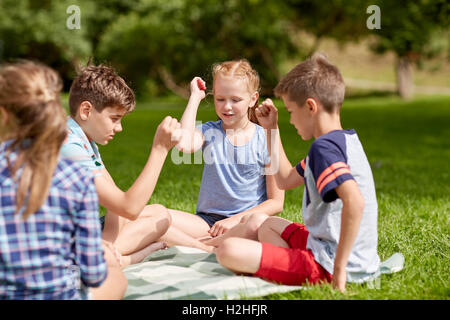 happy kids playing rock-paper-scissors game Stock Photo - Alamy