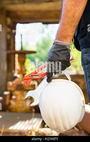 Safety gloves plumbing pipe wrench connectors water valve on wooden ...