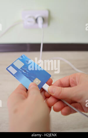 Woman hands holding credit card for online shopping in a office ...