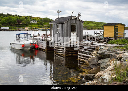 Fishing boats and colorful fishing stages in New Perlican, Newfoundland ...