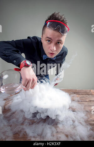 magician in chemical laboratory prepares magical solution Stock Photo ...