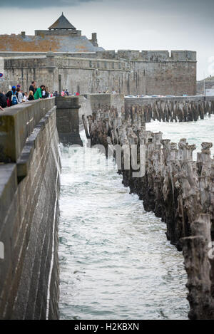 Atlantic beach under the towers of city walls in St Malo in English ...