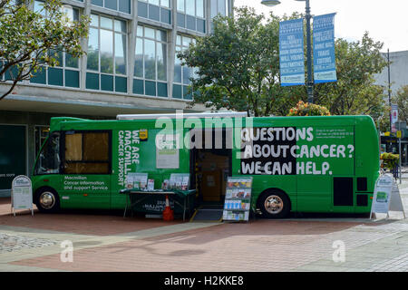 green macmillan cancer charity bus being used as a mobile information ...