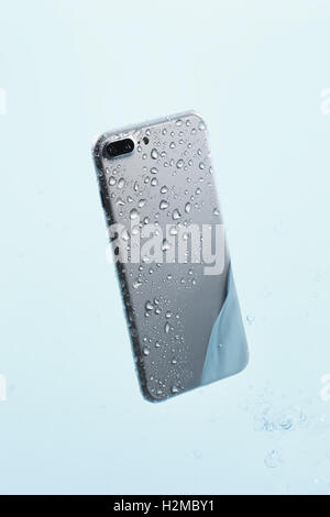Waterproof smartphone covered with water Stock Photo - Alamy