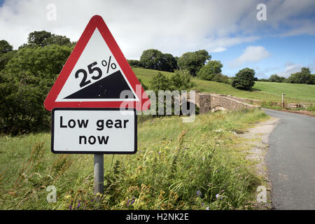 warning steep road sign with 25 percent grade and truck on hill Stock ...