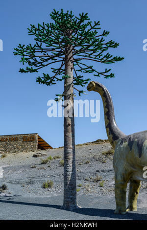 Statue of a sauropod eating the branches of Araucaria in the village of ...