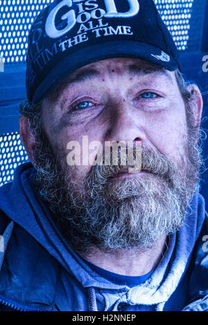 Homeless Man at Bus Stop Stock Photo - Alamy