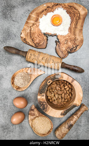top view eggs, dough, flour and rolling-pin on wooden table Stock Photo ...