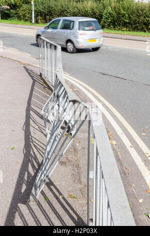 Damaged guard rail or guardrail between the pavement and road following ...