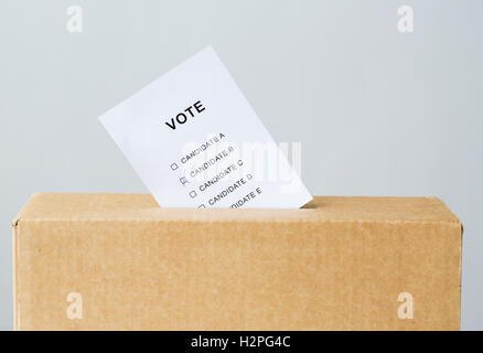vote inserted into ballot box slot on election Stock Photo - Alamy