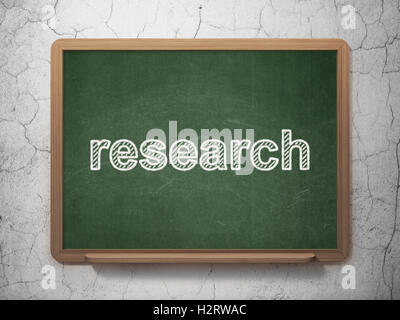 Advertising concept: Research on chalkboard background Stock Photo - Alamy
