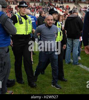 A man is led away by police during a Defend Our Juries protest in ...