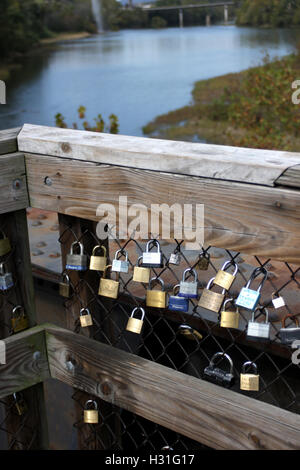 Locks hanged by people on the bridge over James River on Lynchburg ...