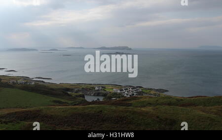 Elevated view of Cullipool on Isle of Luing with islands including ...