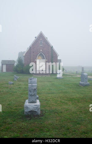 Creepy chapel in a foggy cemetery Stock Photo - Alamy