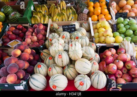 Fresh produce on display outside grocery store in the early evening ...