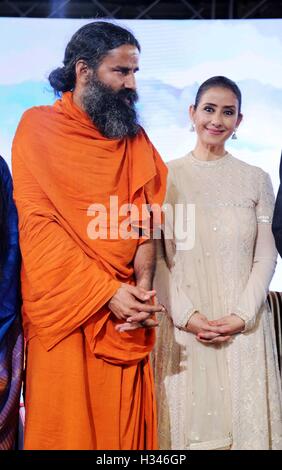 Yoga guru Baba Ramdev and Bollywood actor Manisha Koirala during the ...