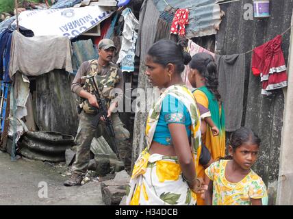 Force One commando conducts a search combing operation in a slum area ...