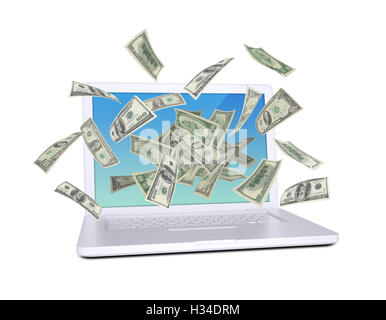 Dollar notes flying around the laptop Stock Photo - Alamy