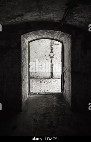Old abandoned empty bunker interior with white walls and rusted ...