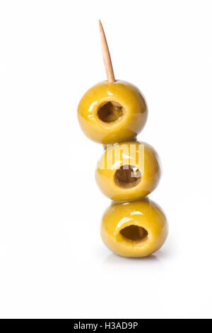 Three whole green olives with olive leaves isolated on white background ...