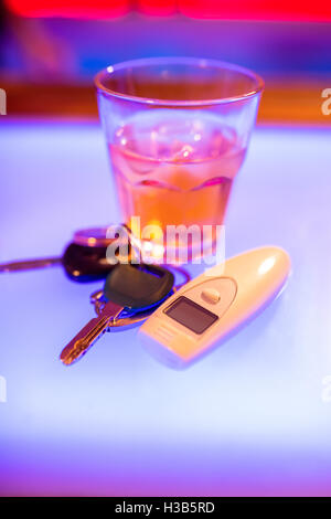 Car keys and a glass of alcohol on a table Stock Photo - Alamy
