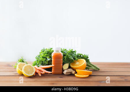 bottle with carrot juice, fruits and vegetables Stock Photo - Alamy