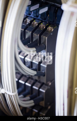 Network data rack with mounted networking equipment closeup. Patch ...