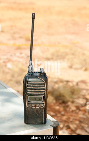 Walkie-talkie - VHF/UHF two-way radio with antenna on the black ...