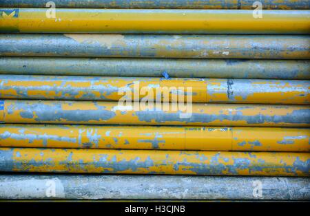 Grunge rusty old metal tubes at construction site Stock Photo - Alamy