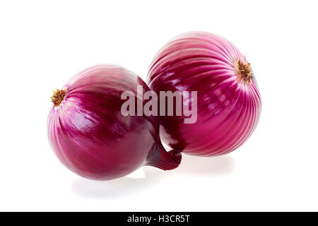 Two red onions on a white background Stock Photo - Alamy