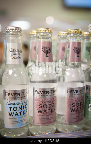 A row of tonic water bottles on a shelf in a grocery store Stock Photo ...