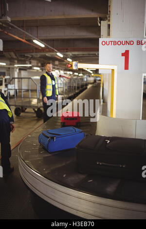 Ground crew unloading baggage from a Tara Air Dornier 228 at Lukla ...