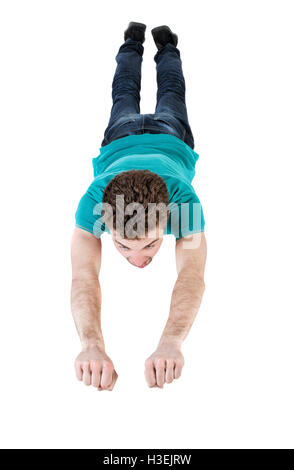 Flying man . Smiling curly-haired guy is flying in Superman pose ...