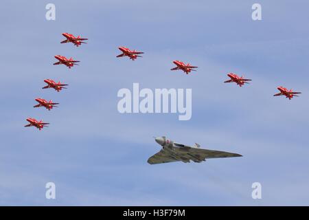 Avro Vulcan bomber and Red Arrows RAF BAe Hawk aircraft in formation at RIAT 2015, Fairford, UK ...