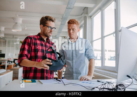 Young men with virtual reality goggles Stock Photo - Alamy