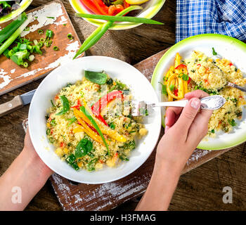 hands holding couscous Stock Photo - Alamy