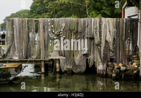 grey fishnets on a landing stage Stock Photo - Alamy