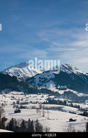 Landscape of Gstaad in Switzerland, with snow in winter Stock Photo - Alamy